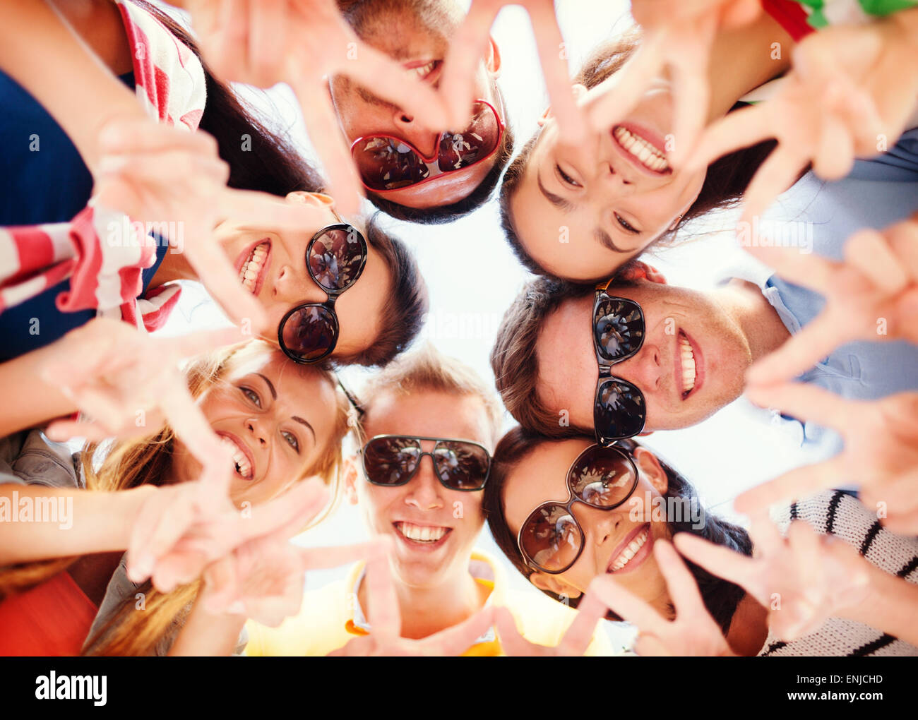 group of teenagers showing finger five gesture Stock Photo - Alamy