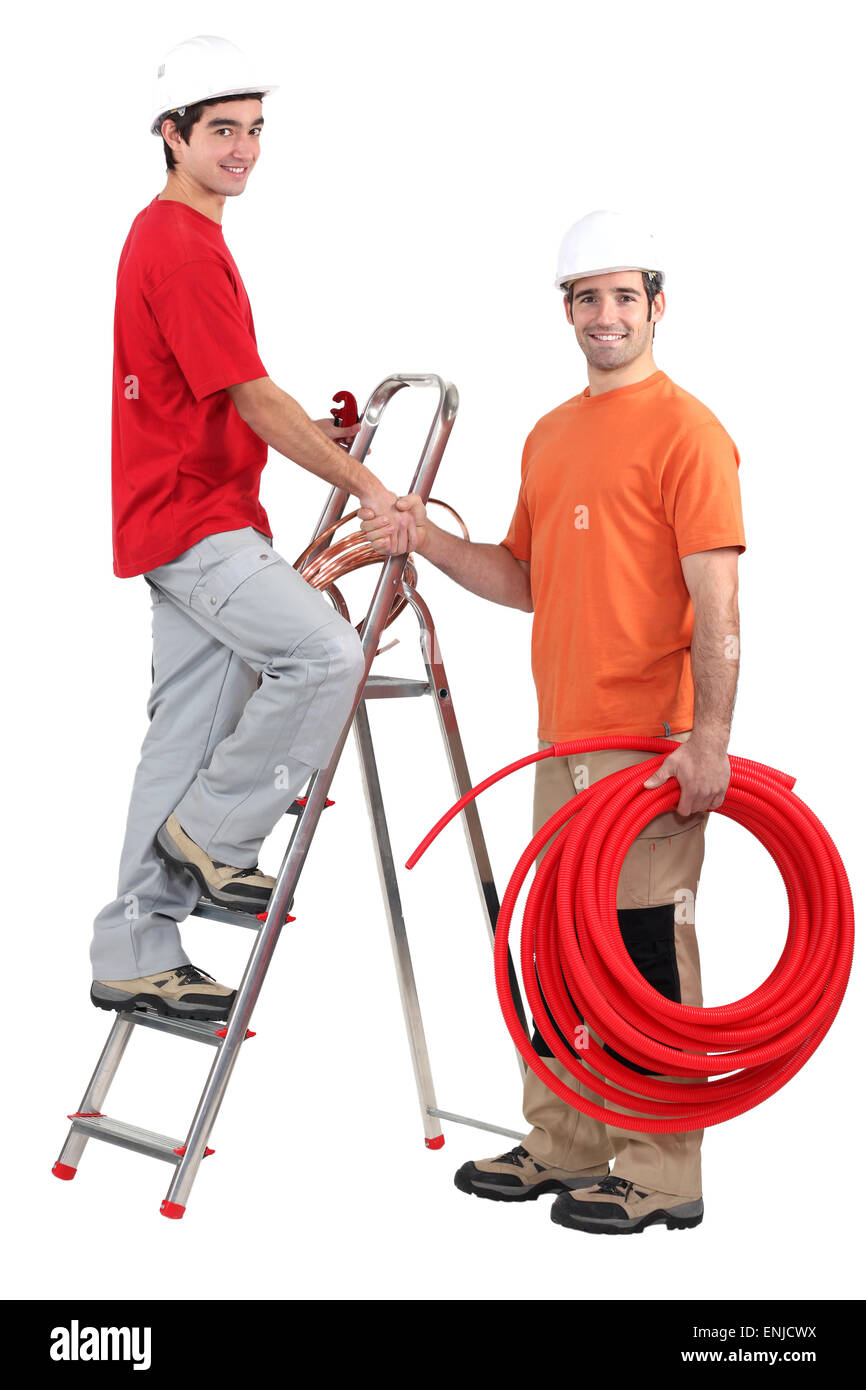 Electricians greeting each other Stock Photo - Alamy