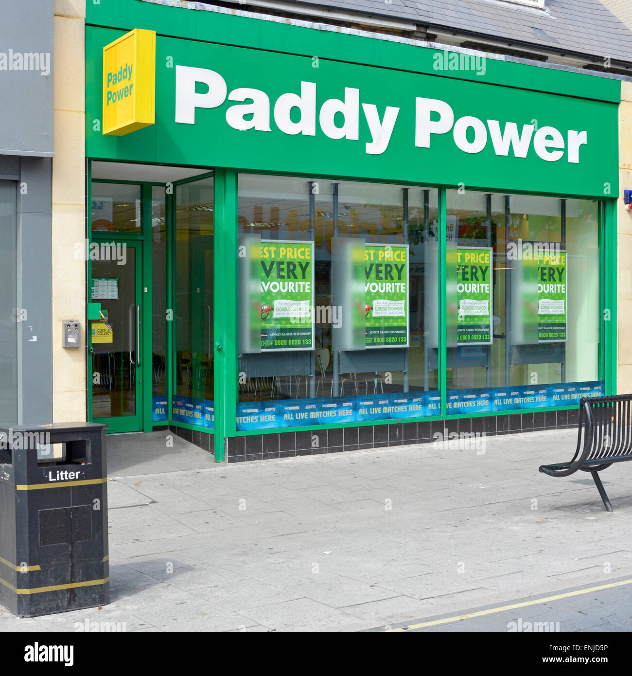 Paddy Power licensed betting shop sign and window with pavement litter ...