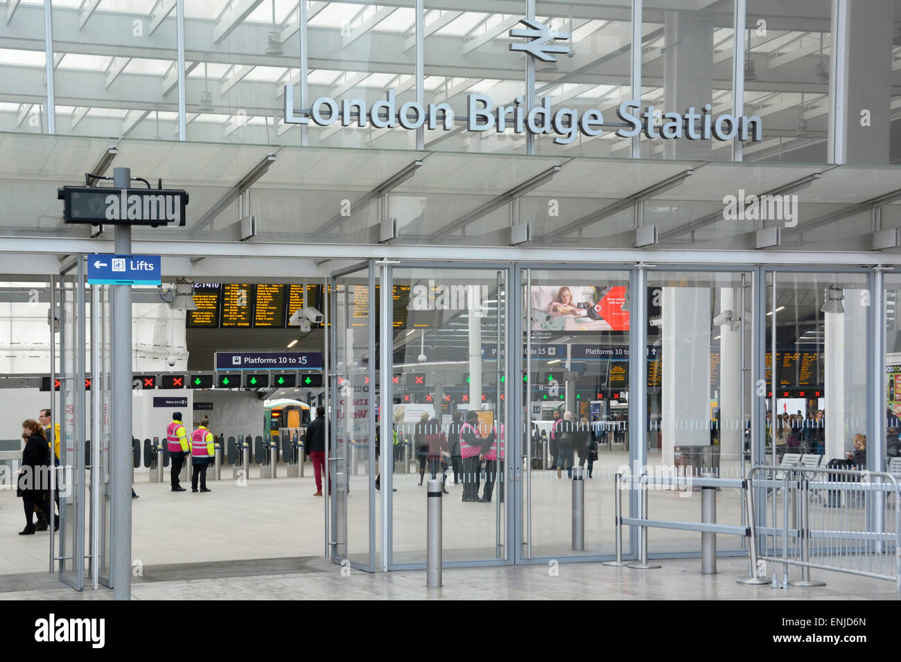 London Bridge station entrance doors with sign and network rail logo ...