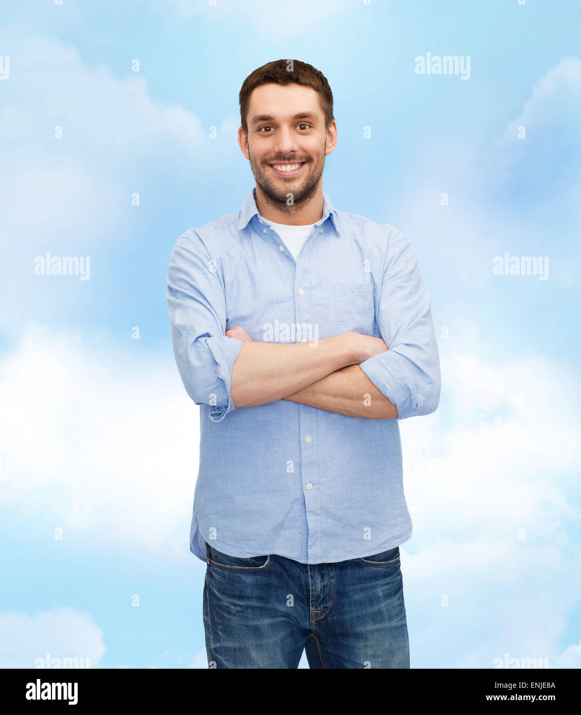 smiling man with crossed arms Stock Photo - Alamy