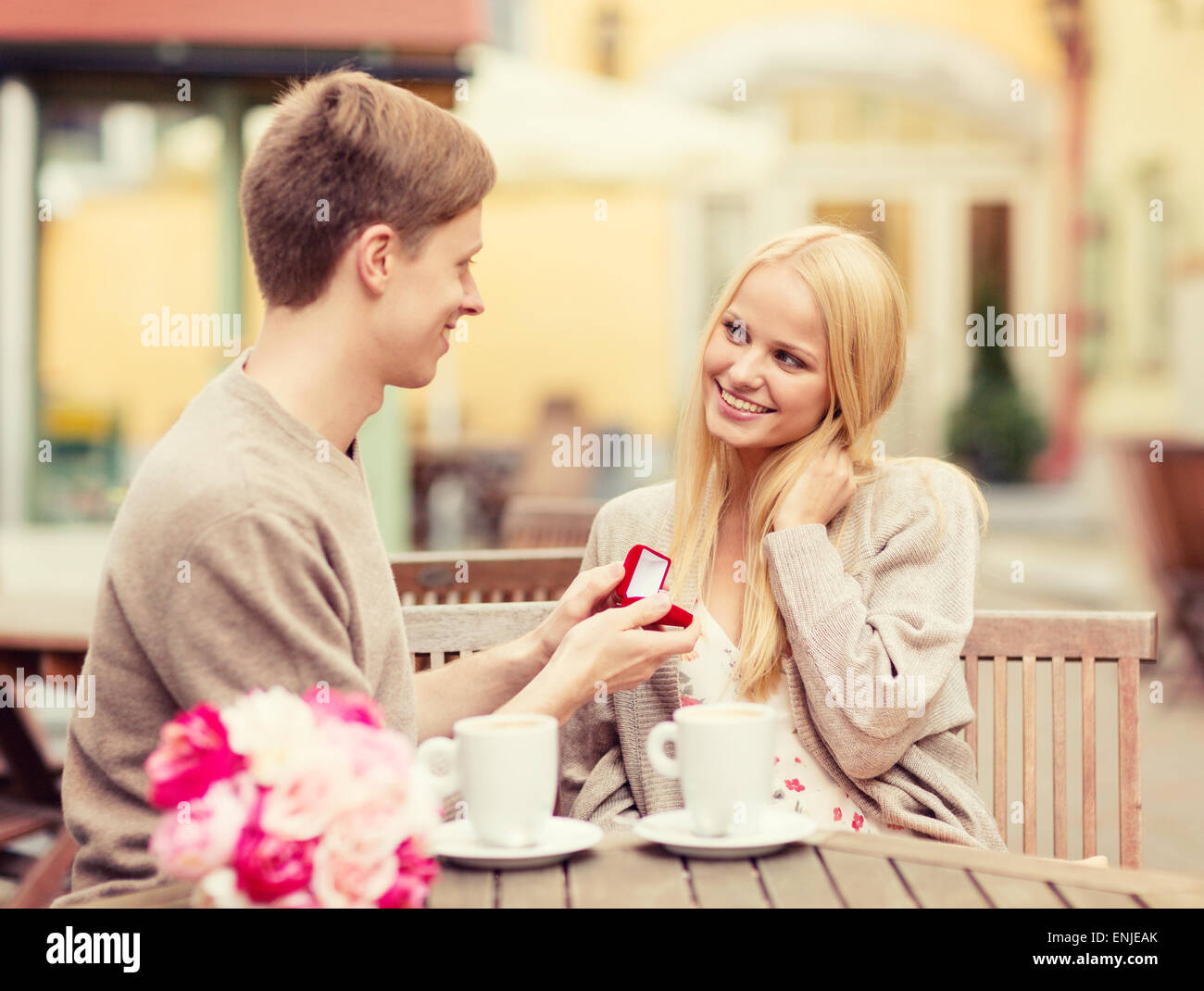 romantic man proposing to beautiful woman Stock Photo - Alamy