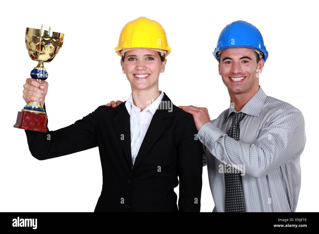 Architects holding a trophy Stock Photo - Alamy