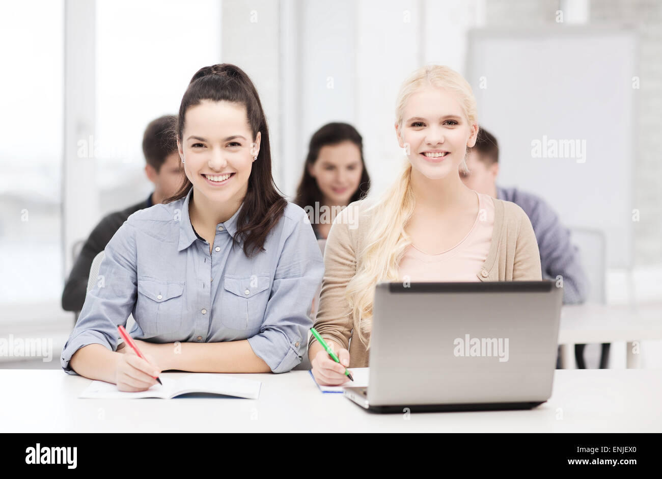 students with laptop and notebooks at school Stock Photo - Alamy