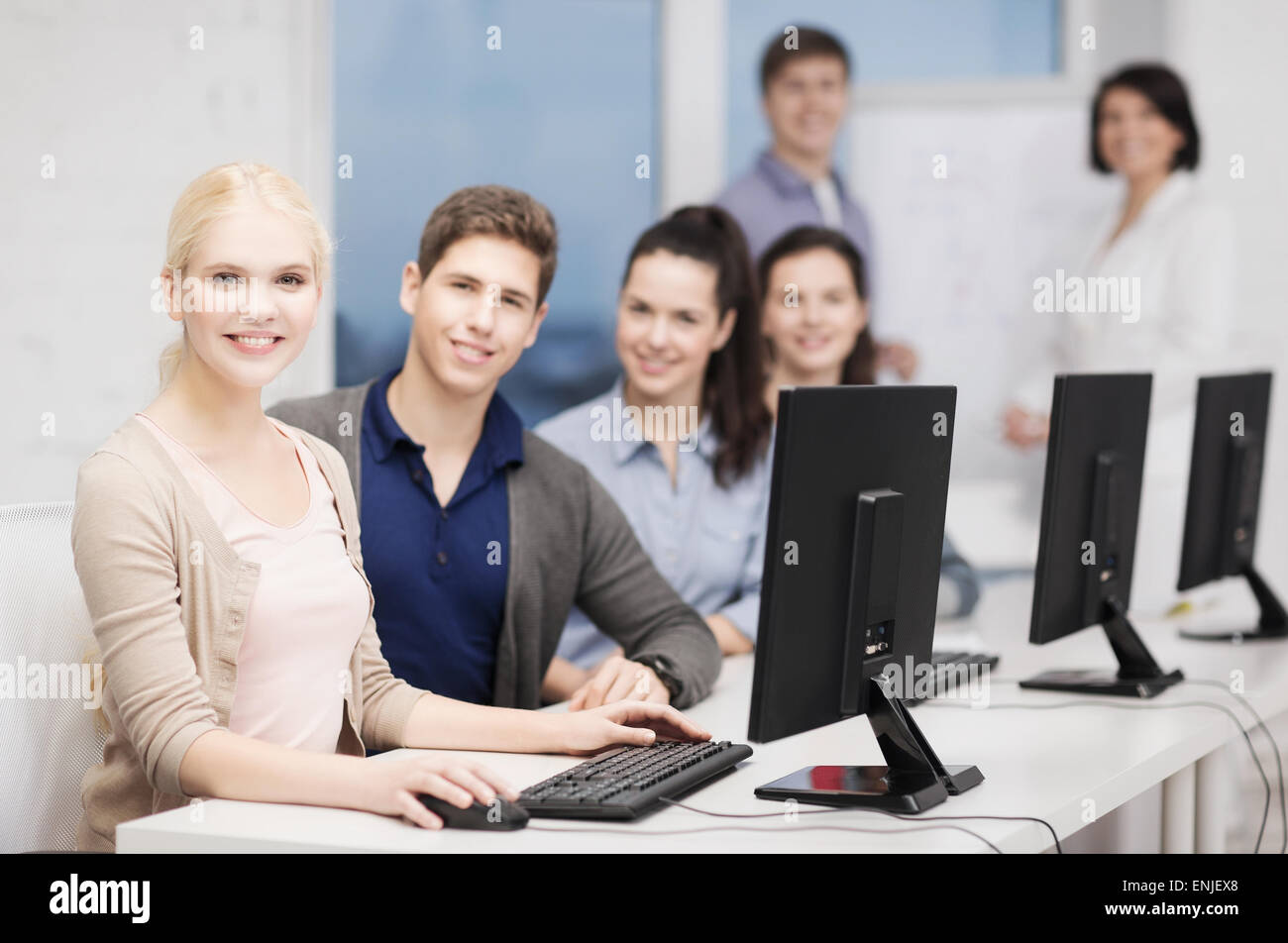 students with computer monitor at school Stock Photo - Alamy