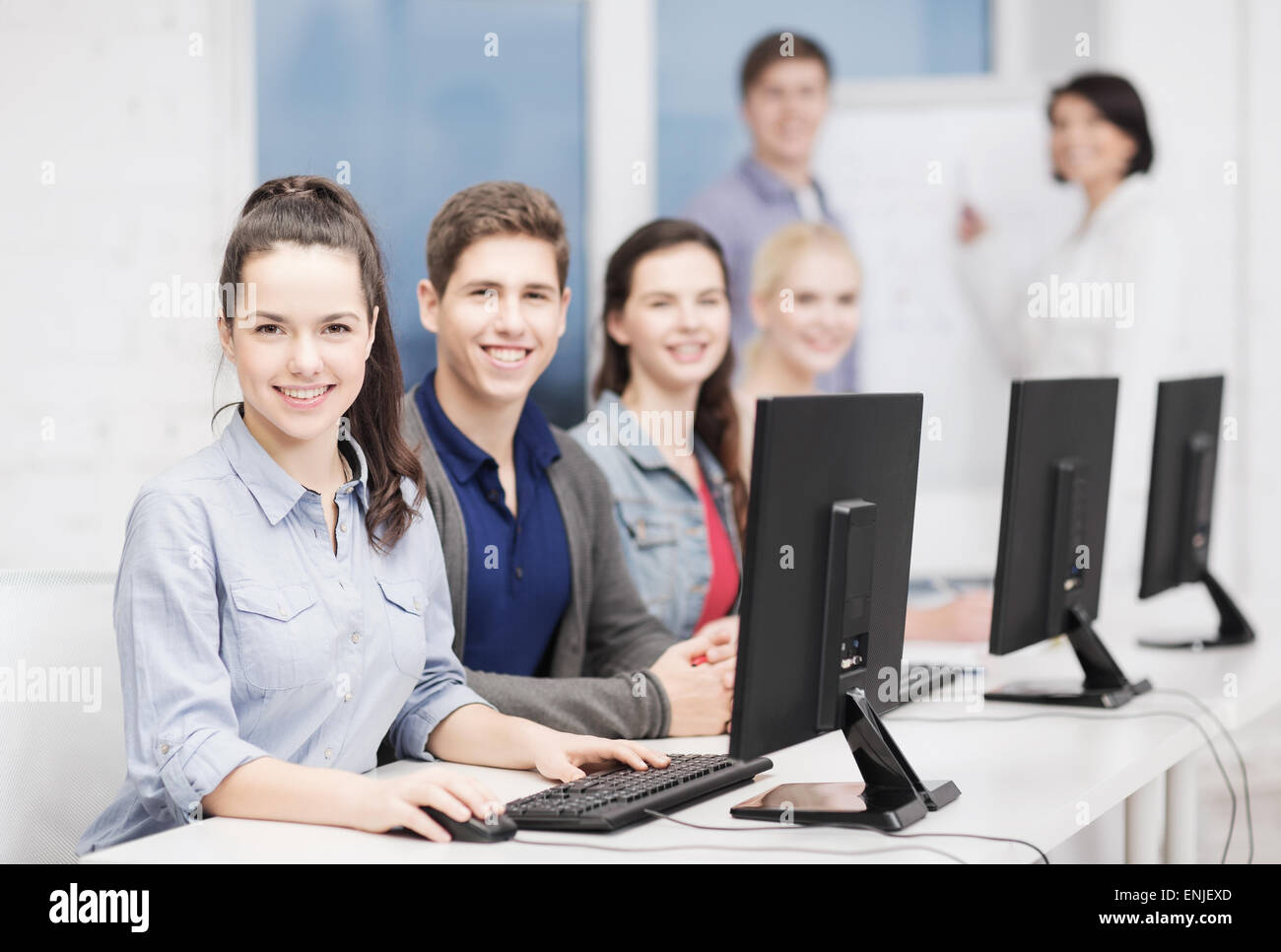 students with computer monitor at school Stock Photo - Alamy
