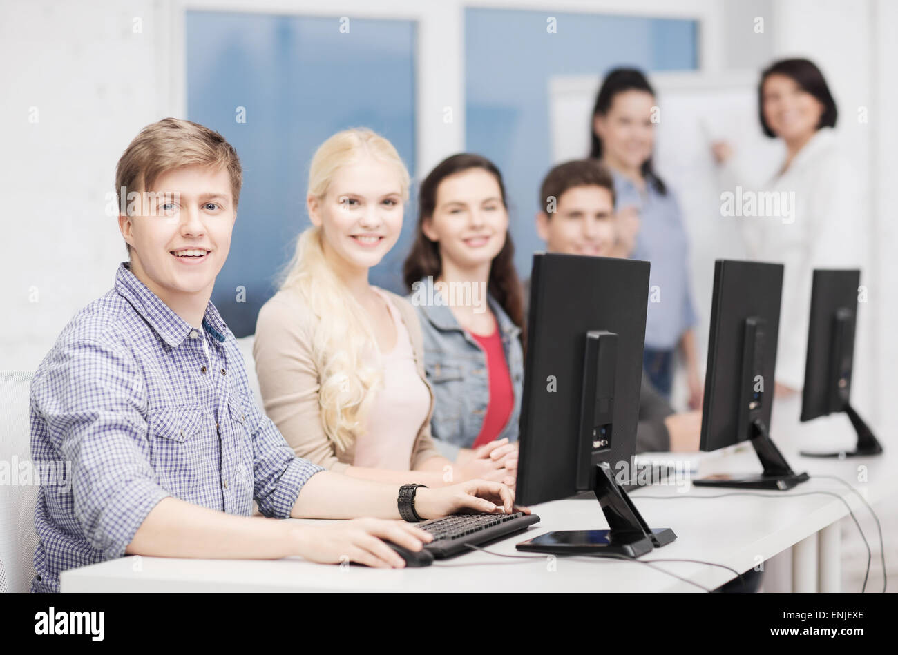 students with computer monitor at school Stock Photo - Alamy