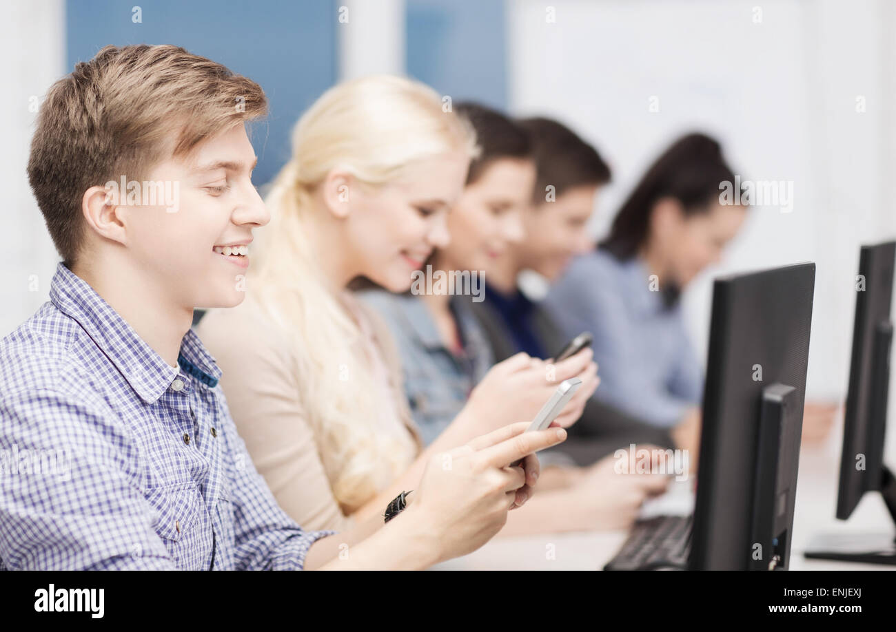 students with computer monitor and smartphones Stock Photo - Alamy