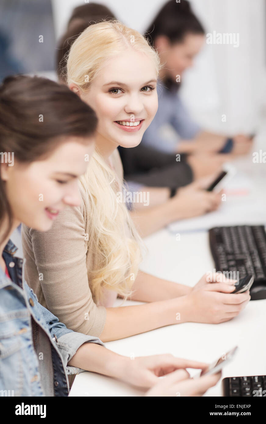 students with computer monitor and smartphones Stock Photo - Alamy