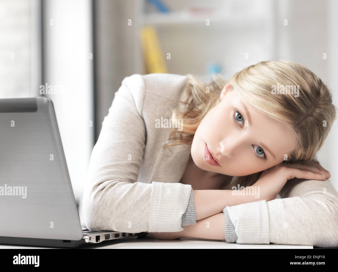 tired woman with laptop computer Stock Photo - Alamy