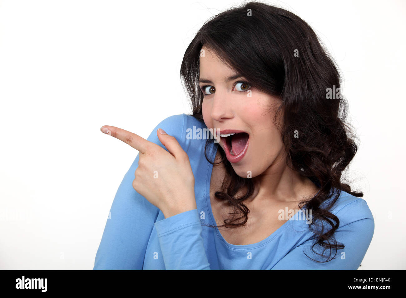 surprised woman pointing Stock Photo - Alamy