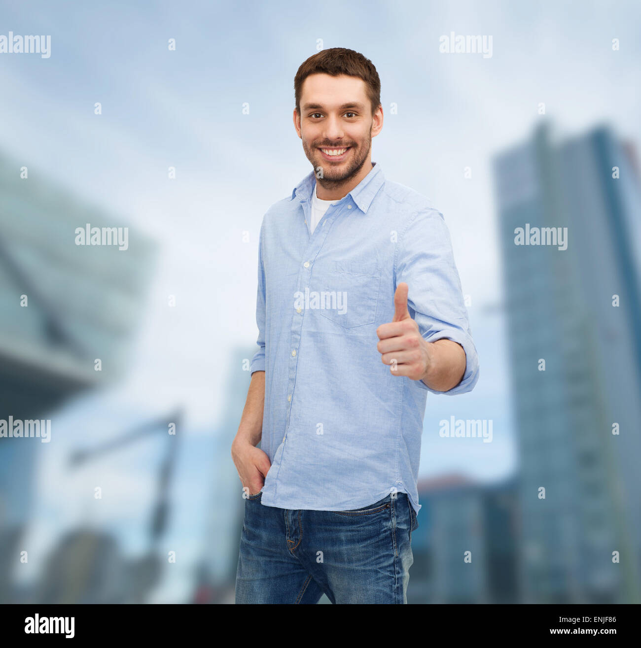 smiling man showing thumbs up Stock Photo - Alamy