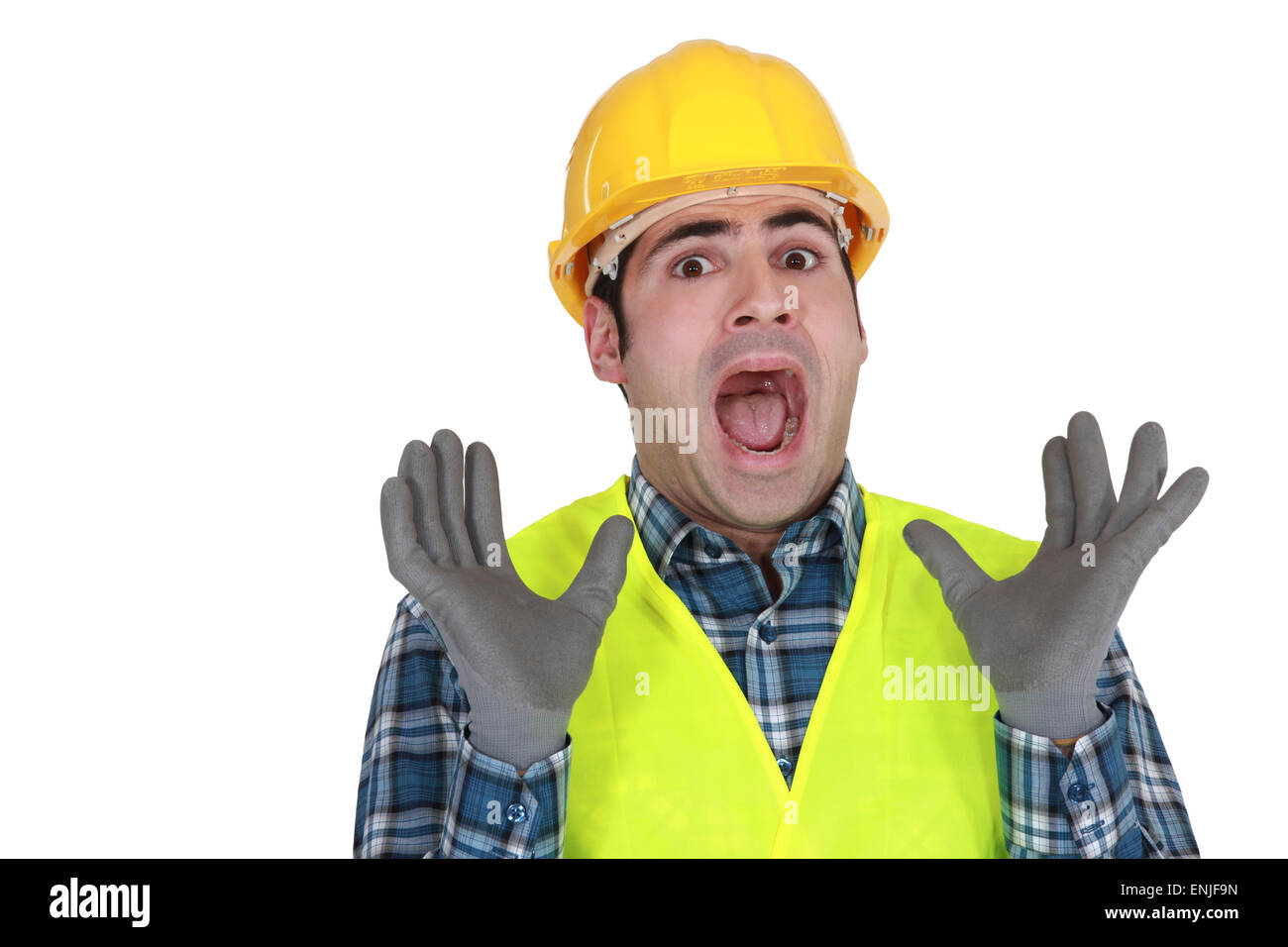 Construction worker letting out a cry of horror Stock Photo - Alamy