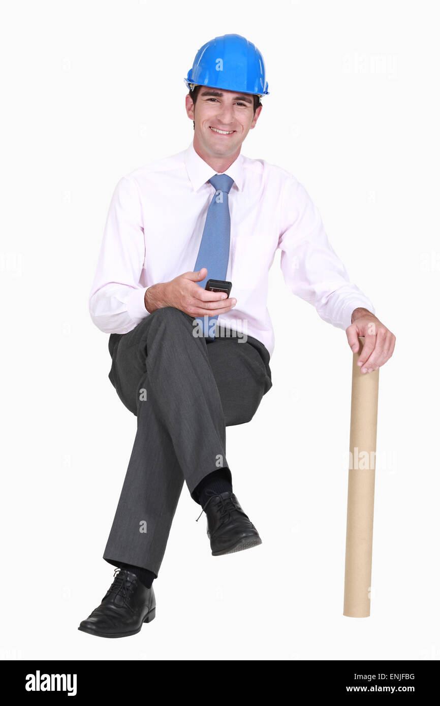 Engineer sitting on an invisible stool Stock Photo - Alamy