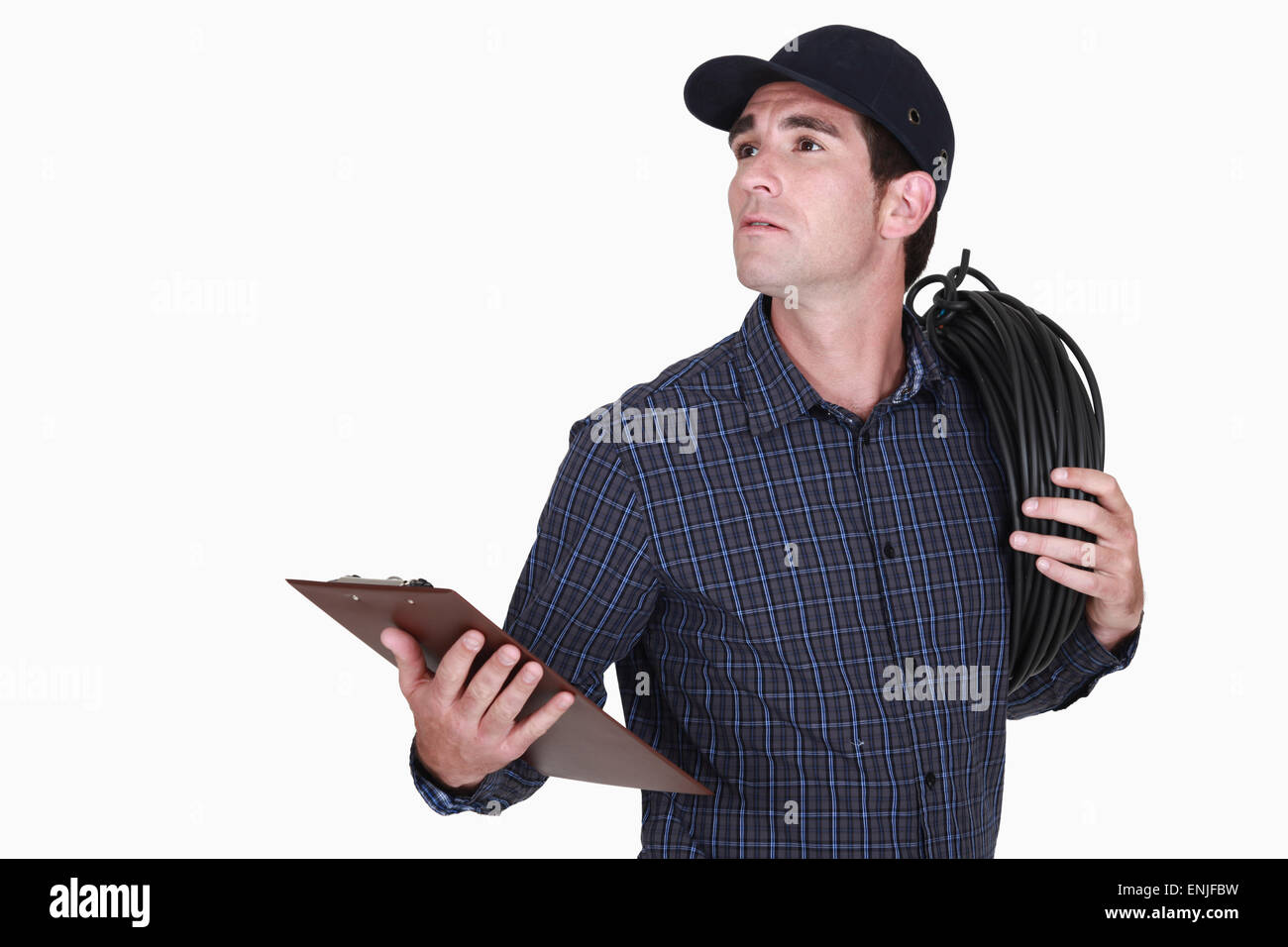 Electrician carrying extension lead Stock Photo - Alamy