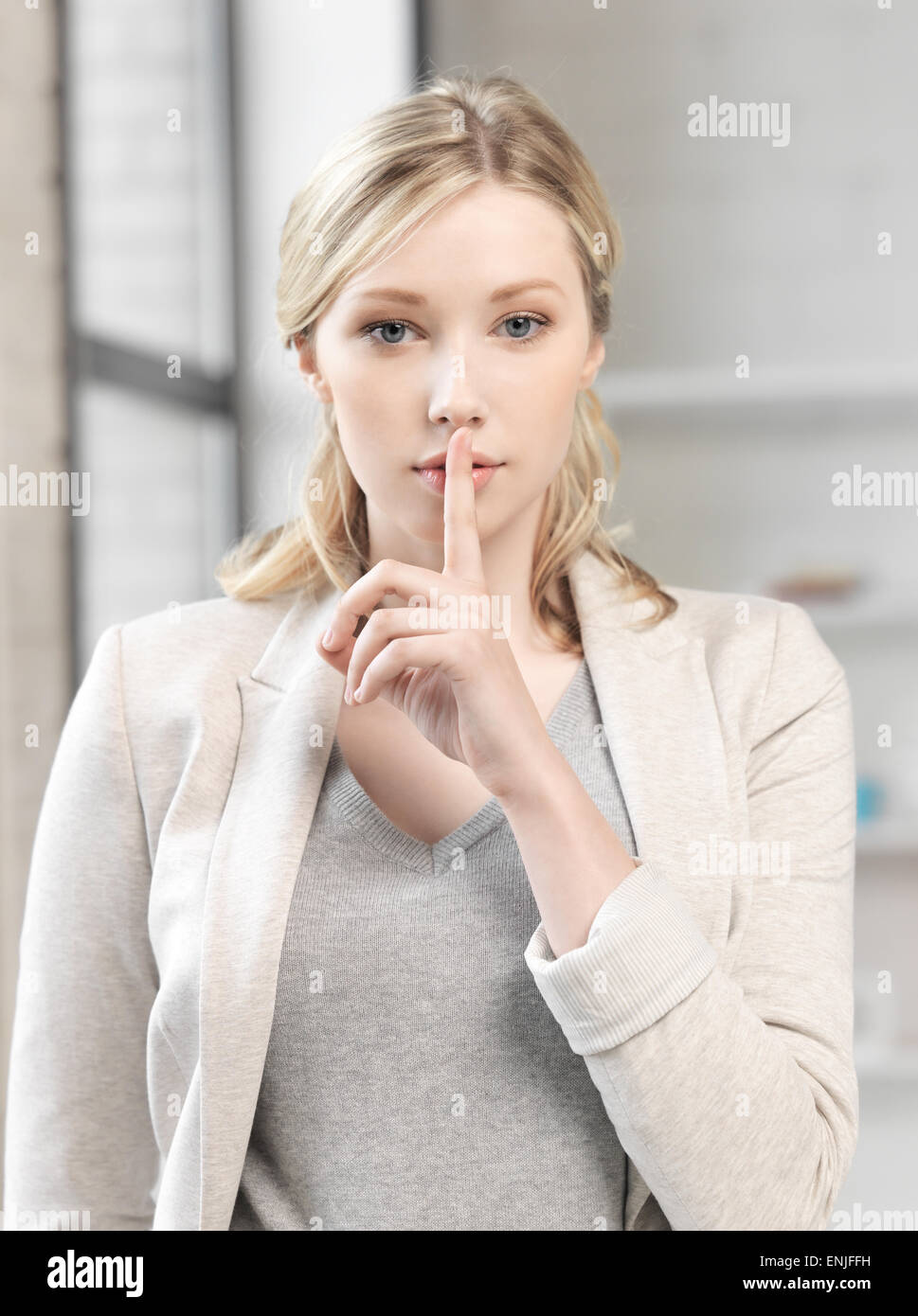 finger on lips Stock Photo - Alamy