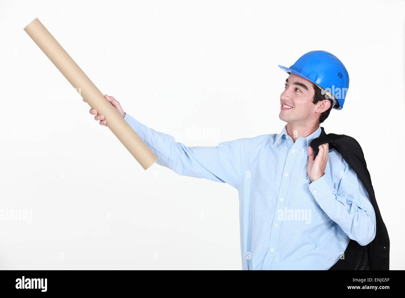 Young engineer holding up a rolled-up drawing Stock Photo - Alamy