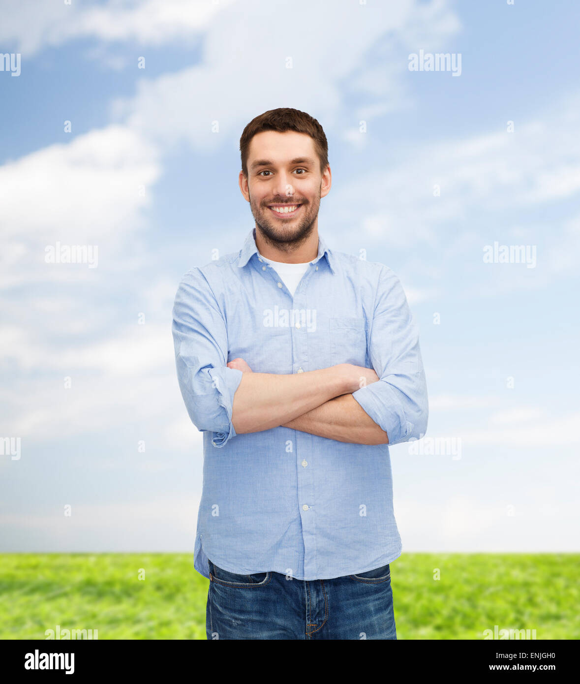 smiling man with crossed arms Stock Photo - Alamy