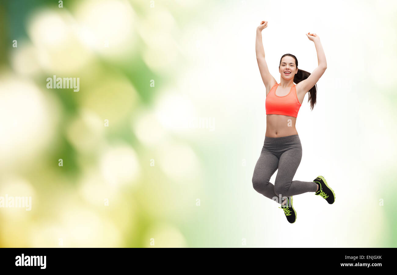 sporty teenage girl jumping in sportswear Stock Photo - Alamy
