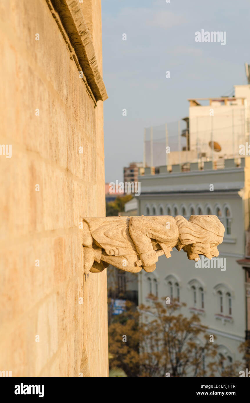 Gargoyle on the facade of a medieval building Stock Photo - Alamy
