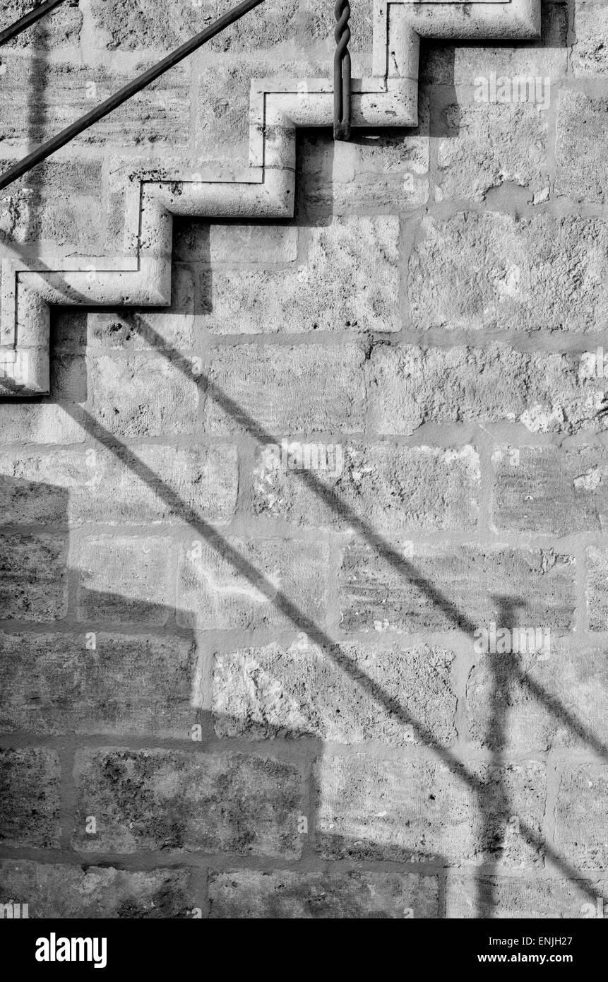 Abstract take of a staircase on an old stone wall Stock Photo - Alamy