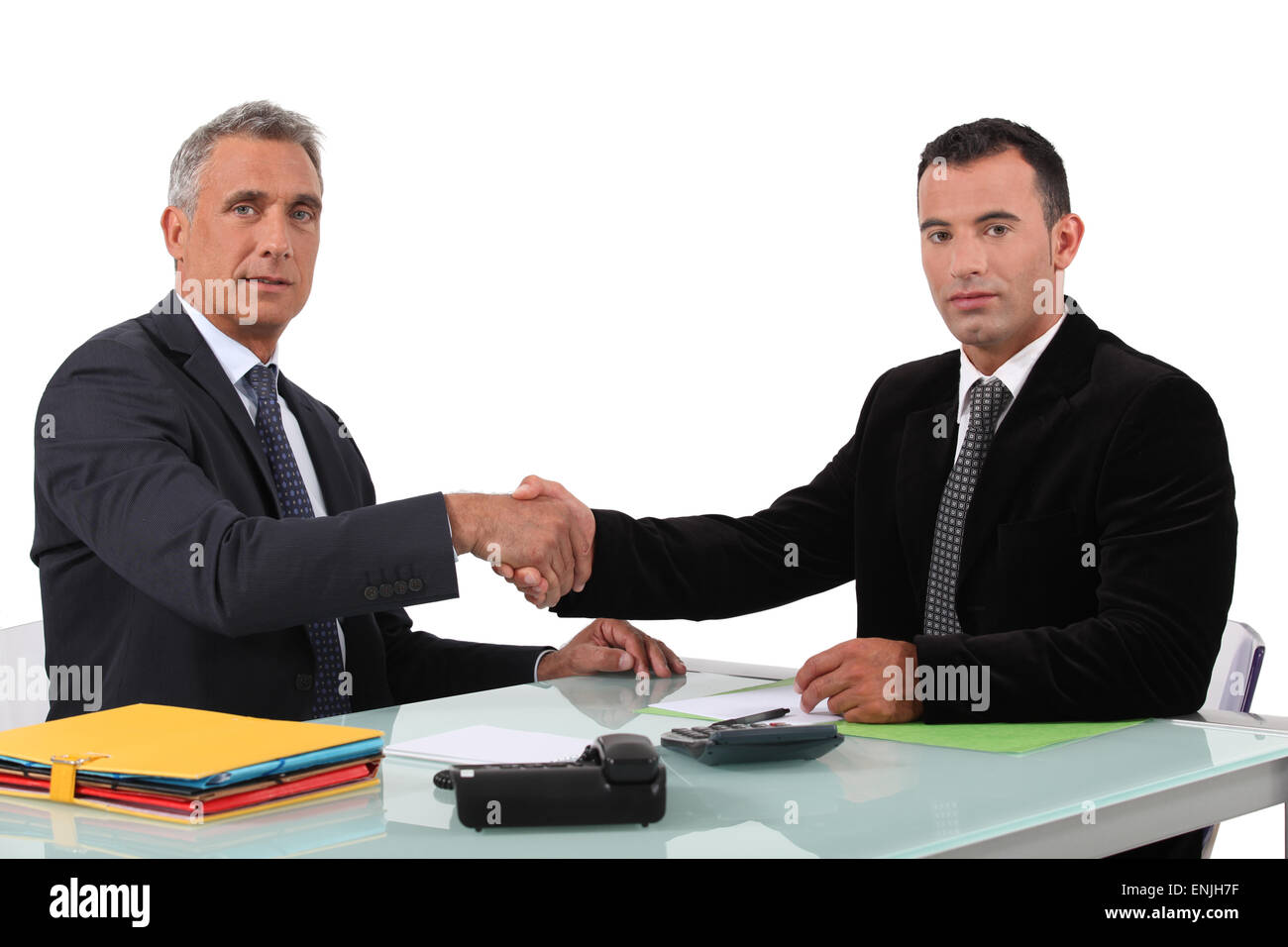 Boss welcoming new colleague Stock Photo - Alamy
