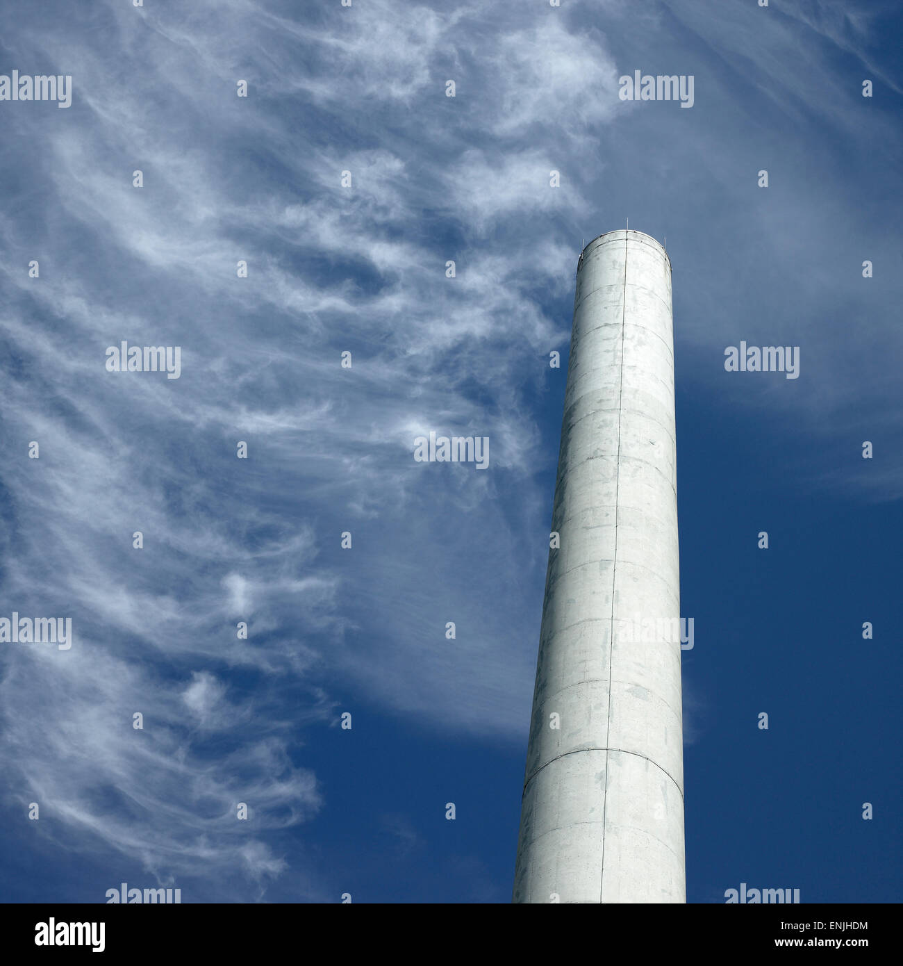 Tall chimney against blue sky Stock Photo - Alamy
