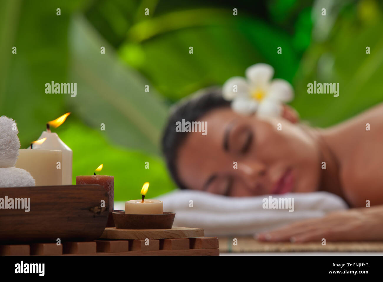 portrait of young beautiful woman in spa environment. blurred face ...