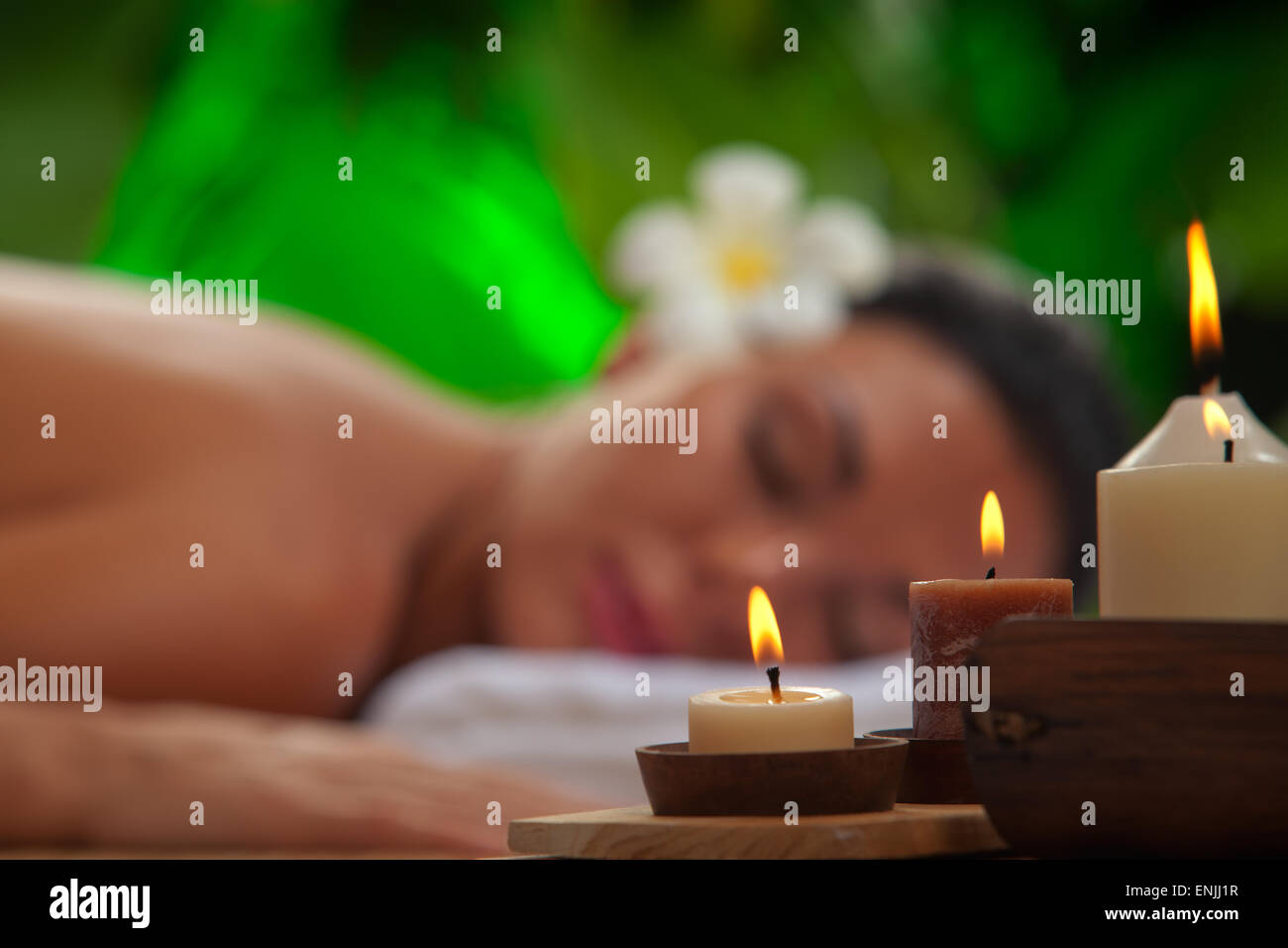 portrait of young beautiful woman in spa environment. blurred face ...