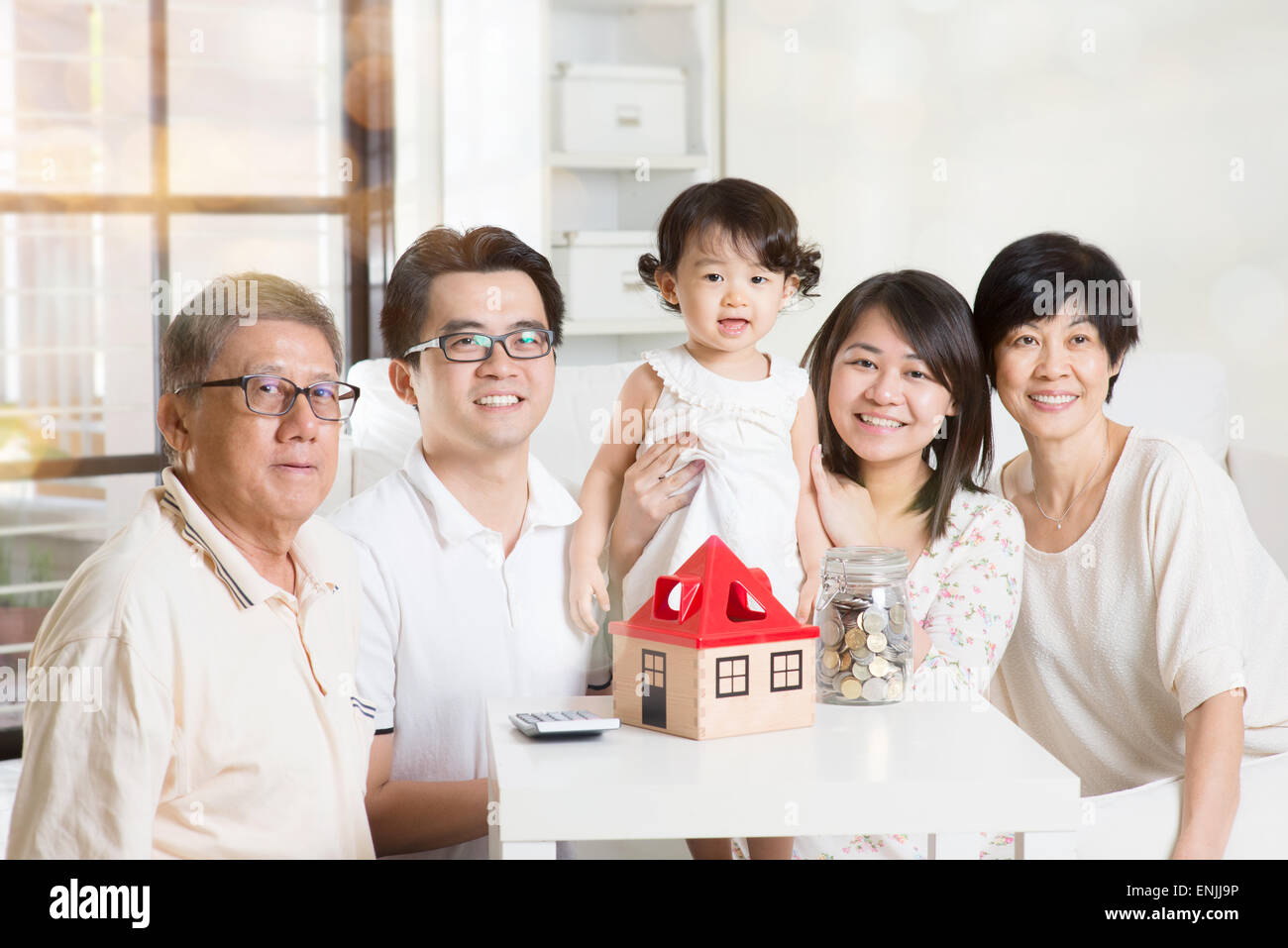 Family future investment or financial planning concept. Asian multi generations lifestyle at ...
