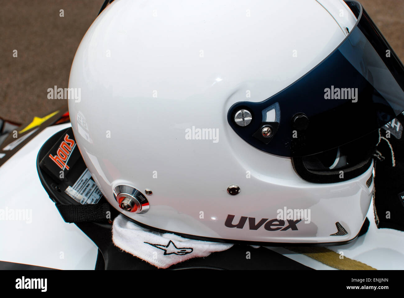 Hans racing system with crash helmet Stock Photo - Alamy