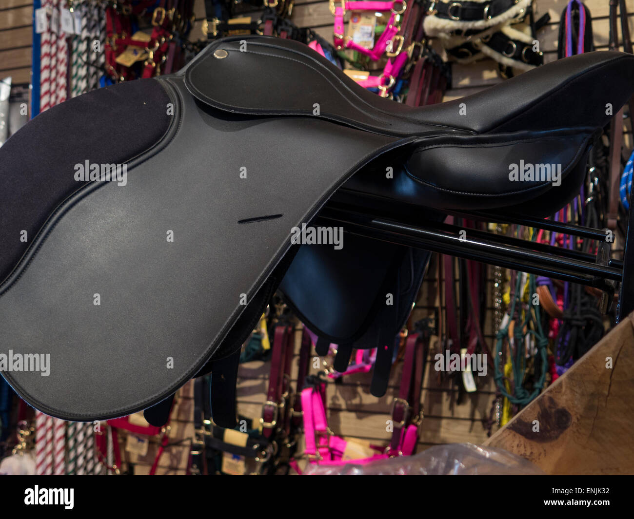 English riding saddle on display in a farm supply store in ...