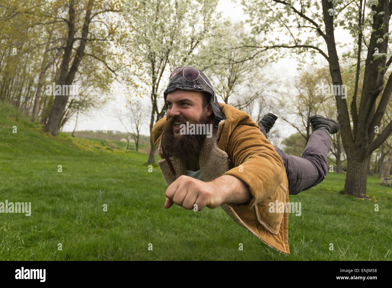 Bearded aviator soars through the air like an airplane Stock Photo - Alamy