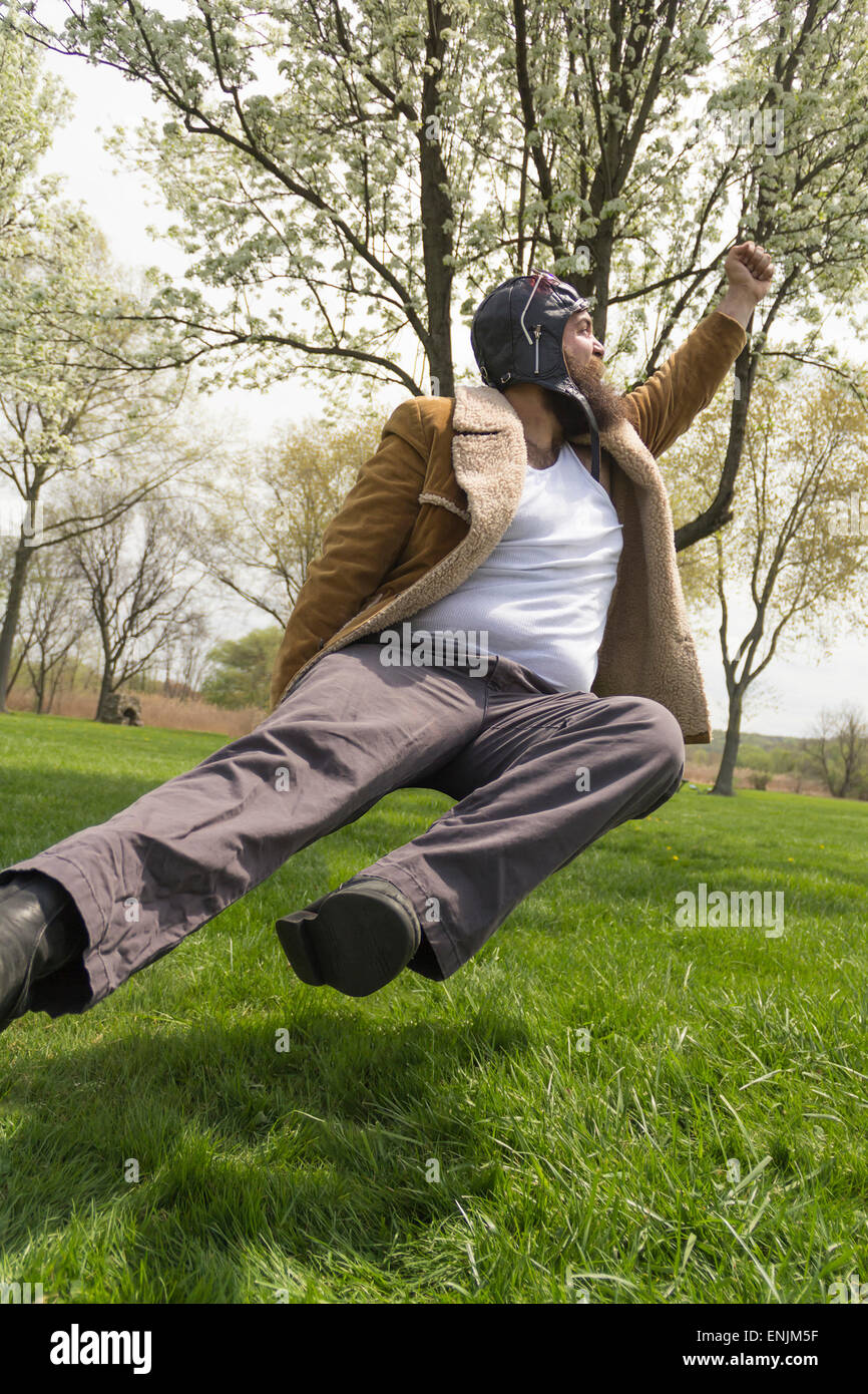 Bearded aviator soars through the air like an airplane Stock Photo - Alamy