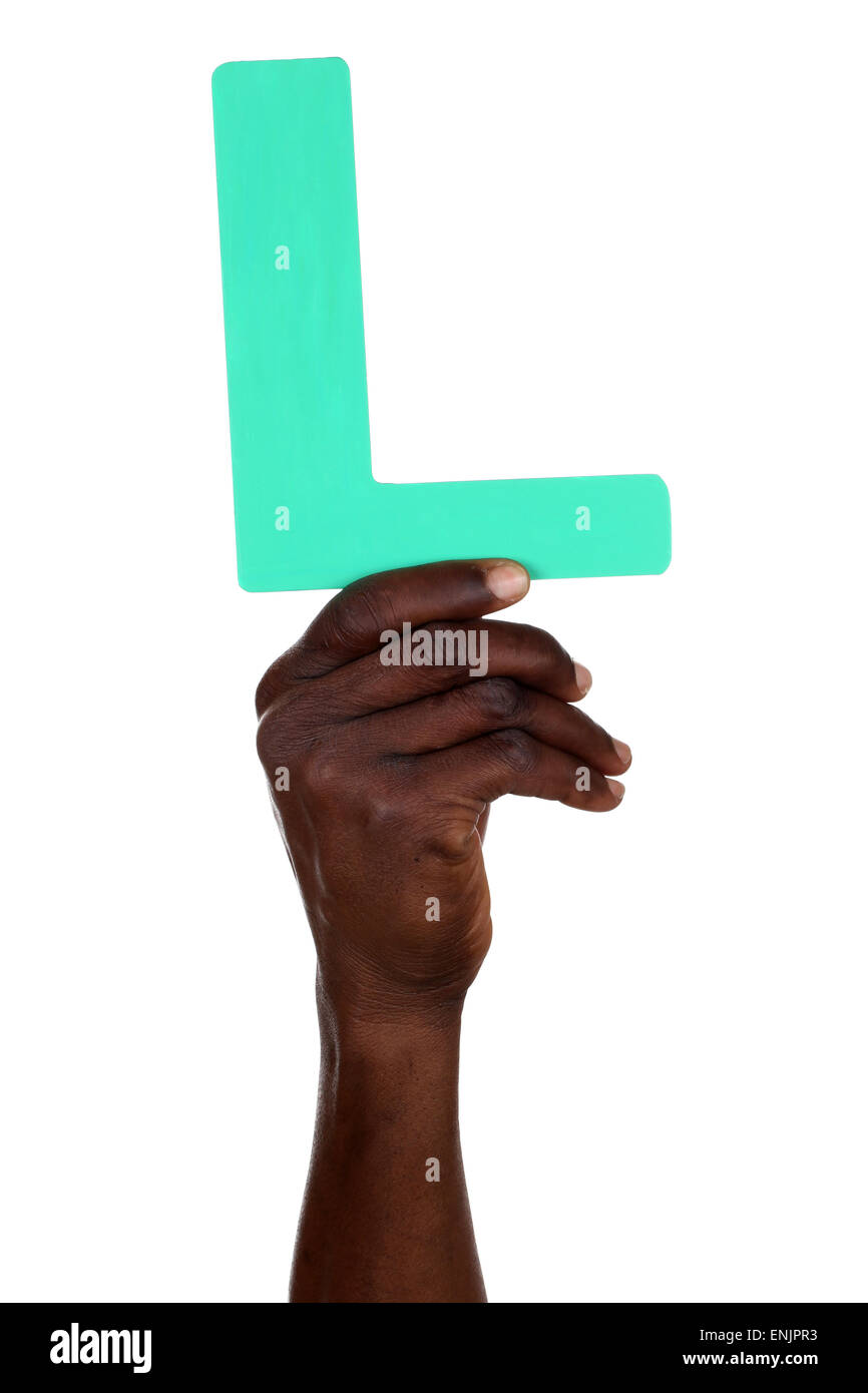 Hand holding letter L from alphabet isolated on a white background ...