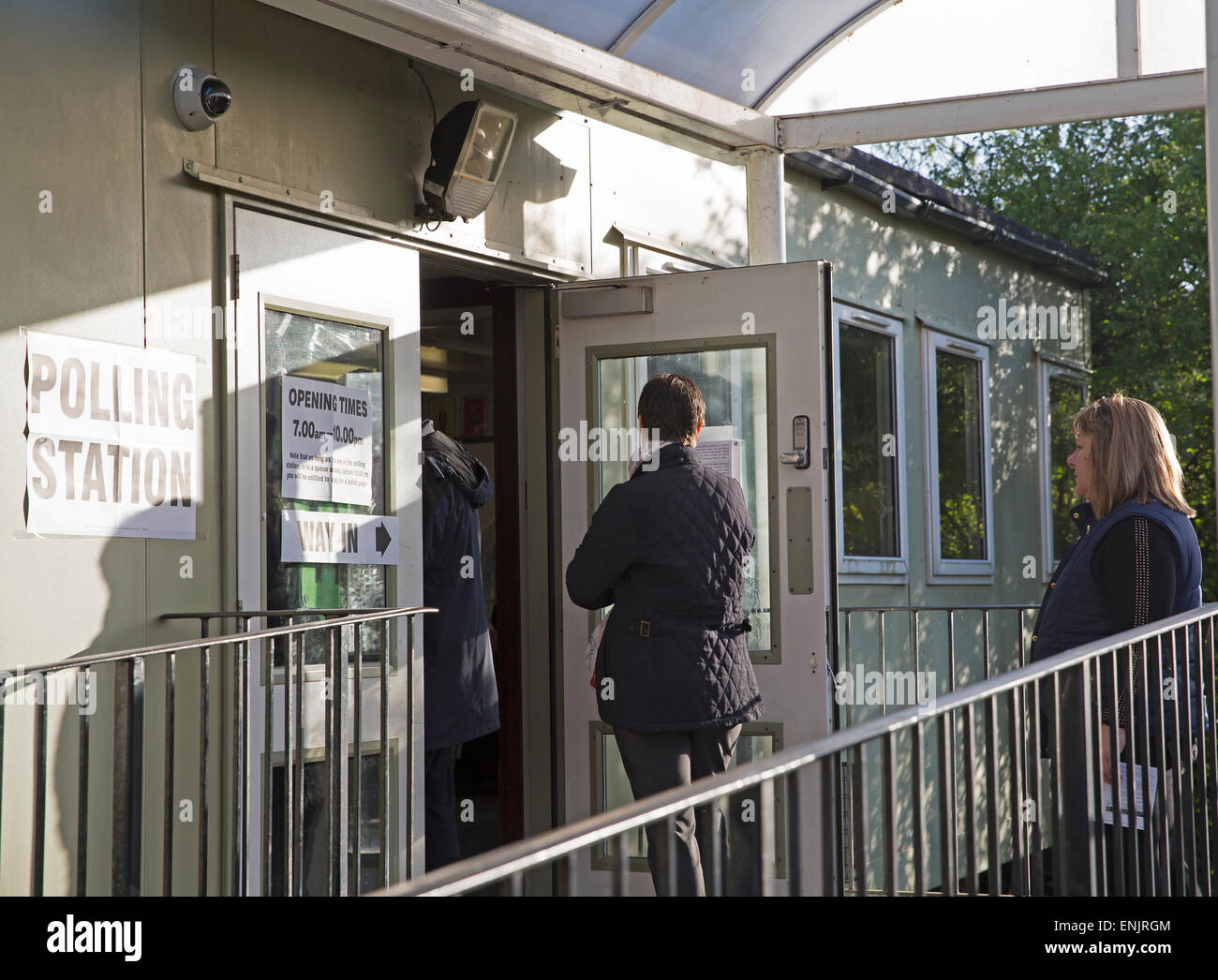 Early morning voters queue at the polling station Stock Photo - Alamy