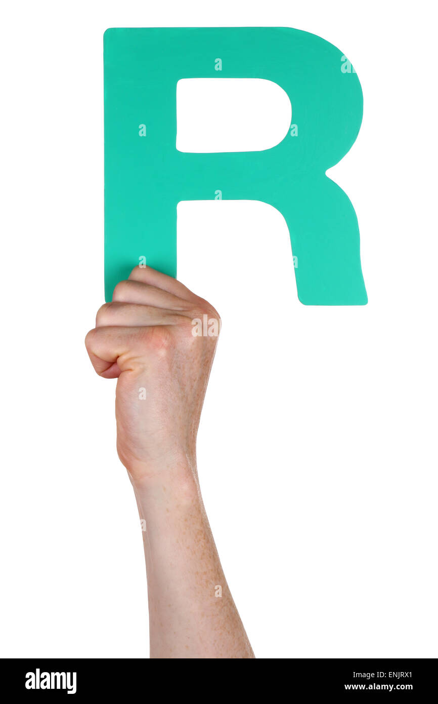 Hand holding letter R from alphabet isolated on a white background ...