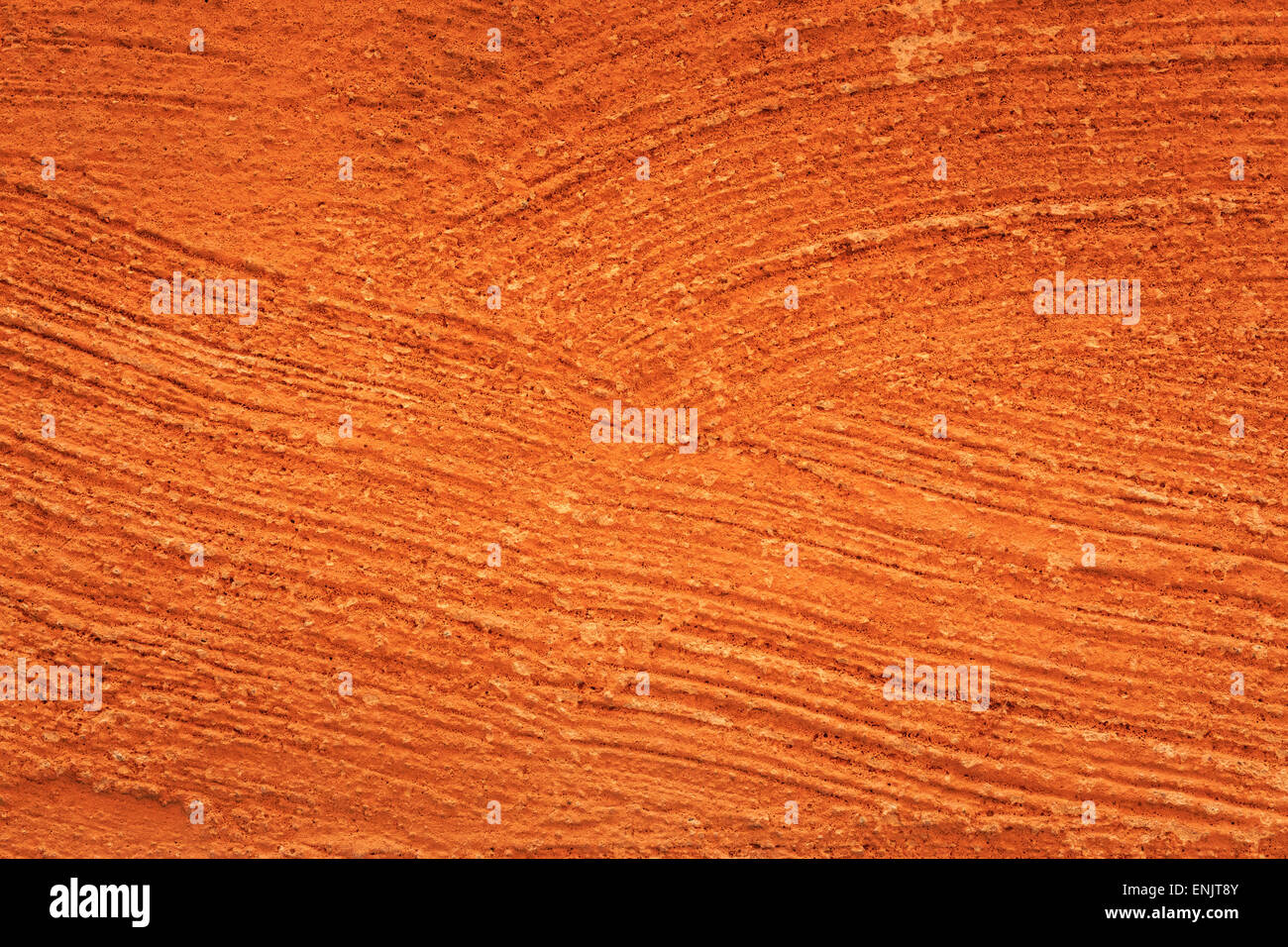 Macro Close-up of structure and details of orange colorful plaster wall ...