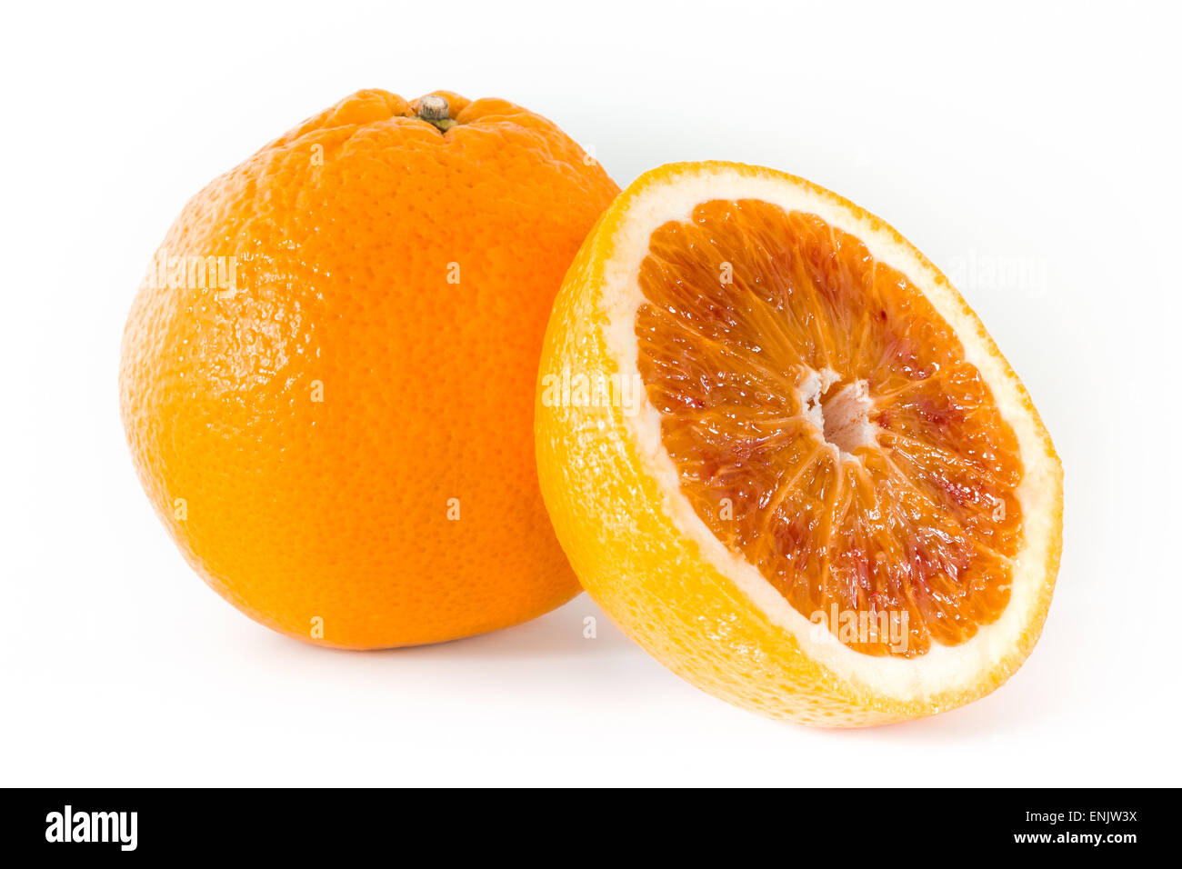 Close up of half orange and one intact, on white Stock Photo - Alamy