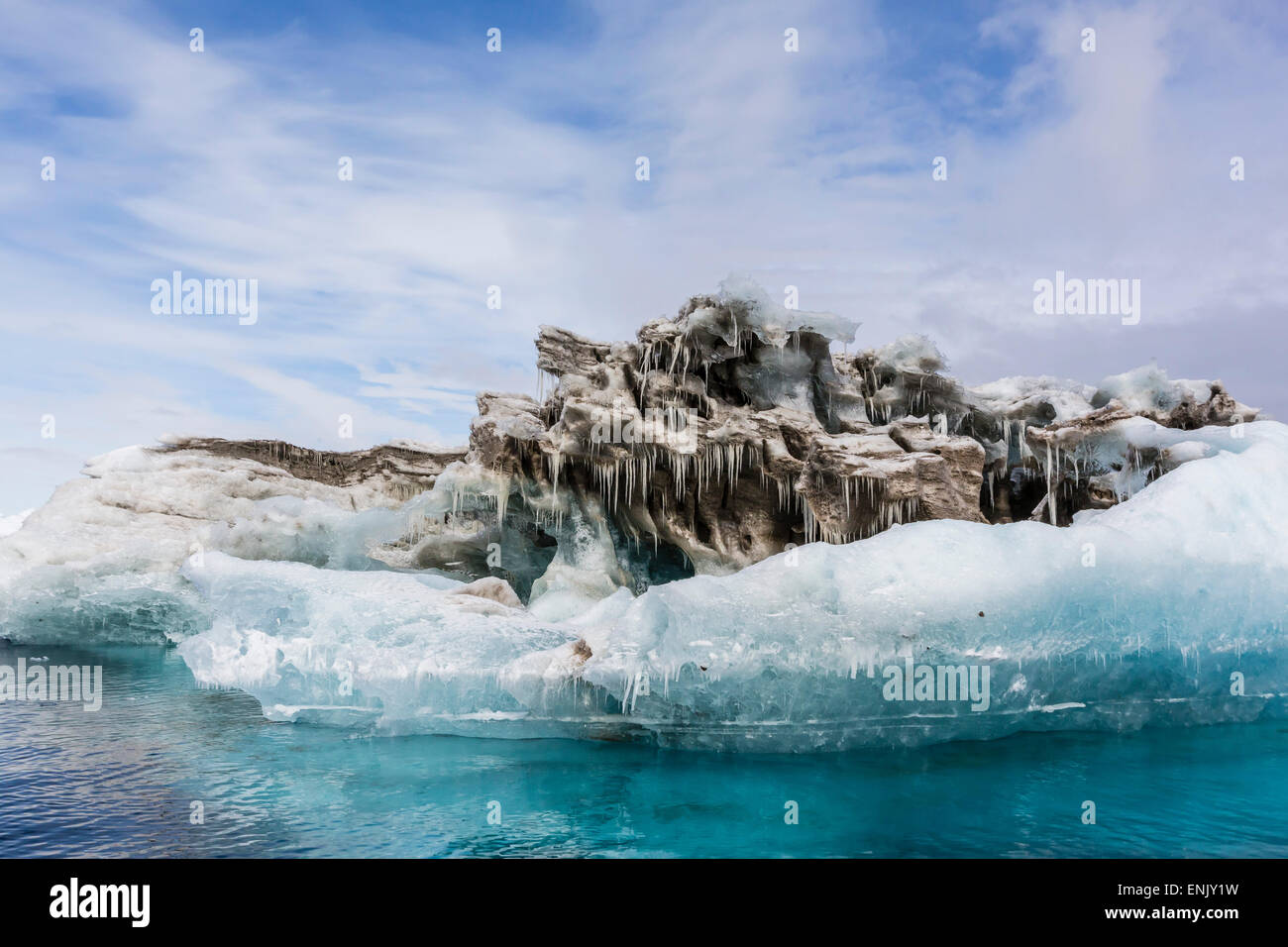 Iceberg with moraine material and icicles at Booth Island, Antarctica ...
