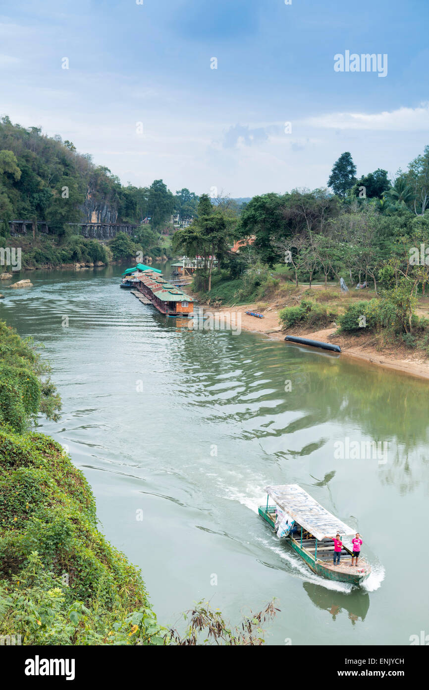 A boat on the River Kwai with the POW-built Wampoo Viaduct behind ...