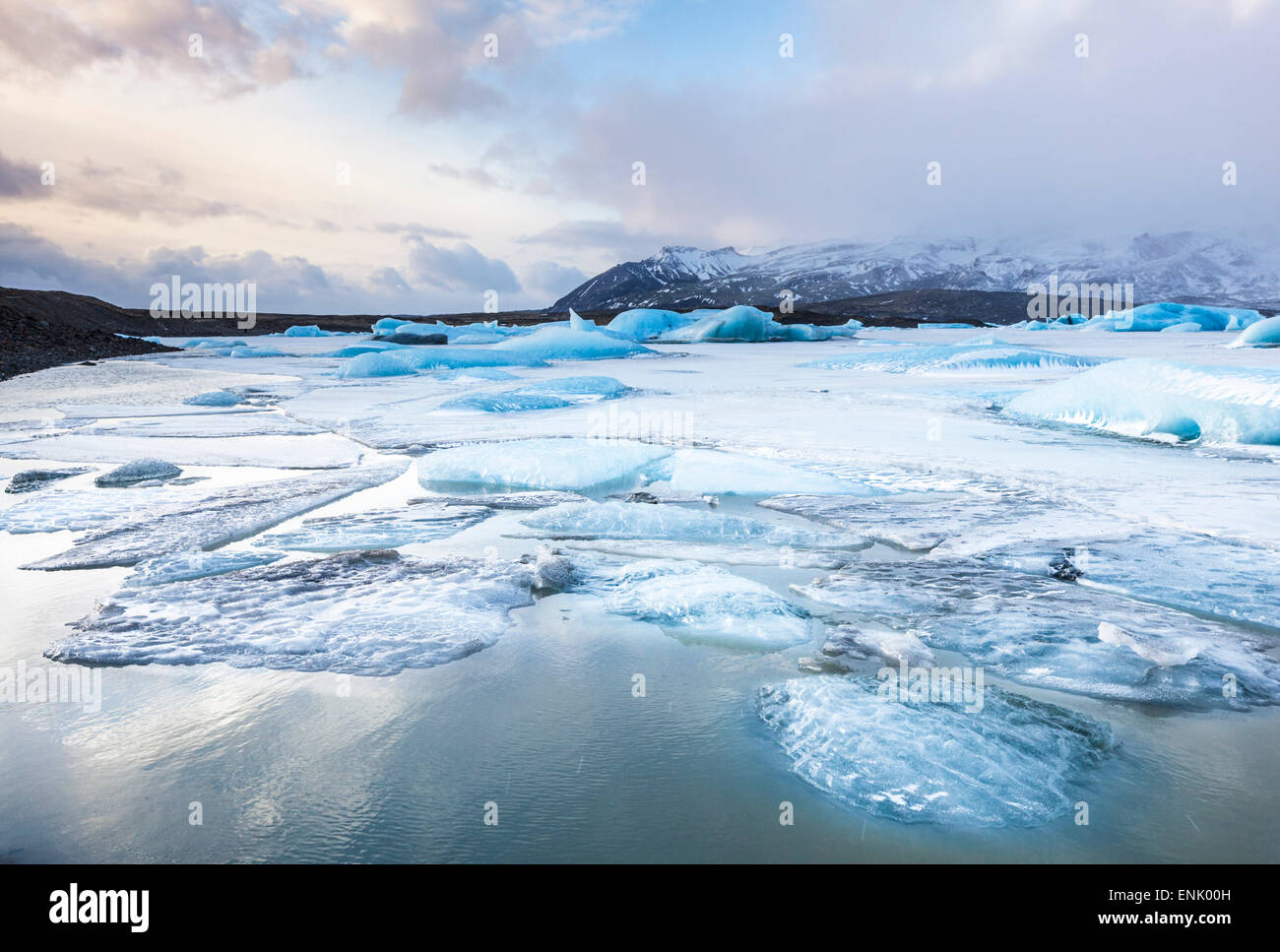 Frozen icebergs locked in the frozen waters of Fjallsarlon Glacier ...