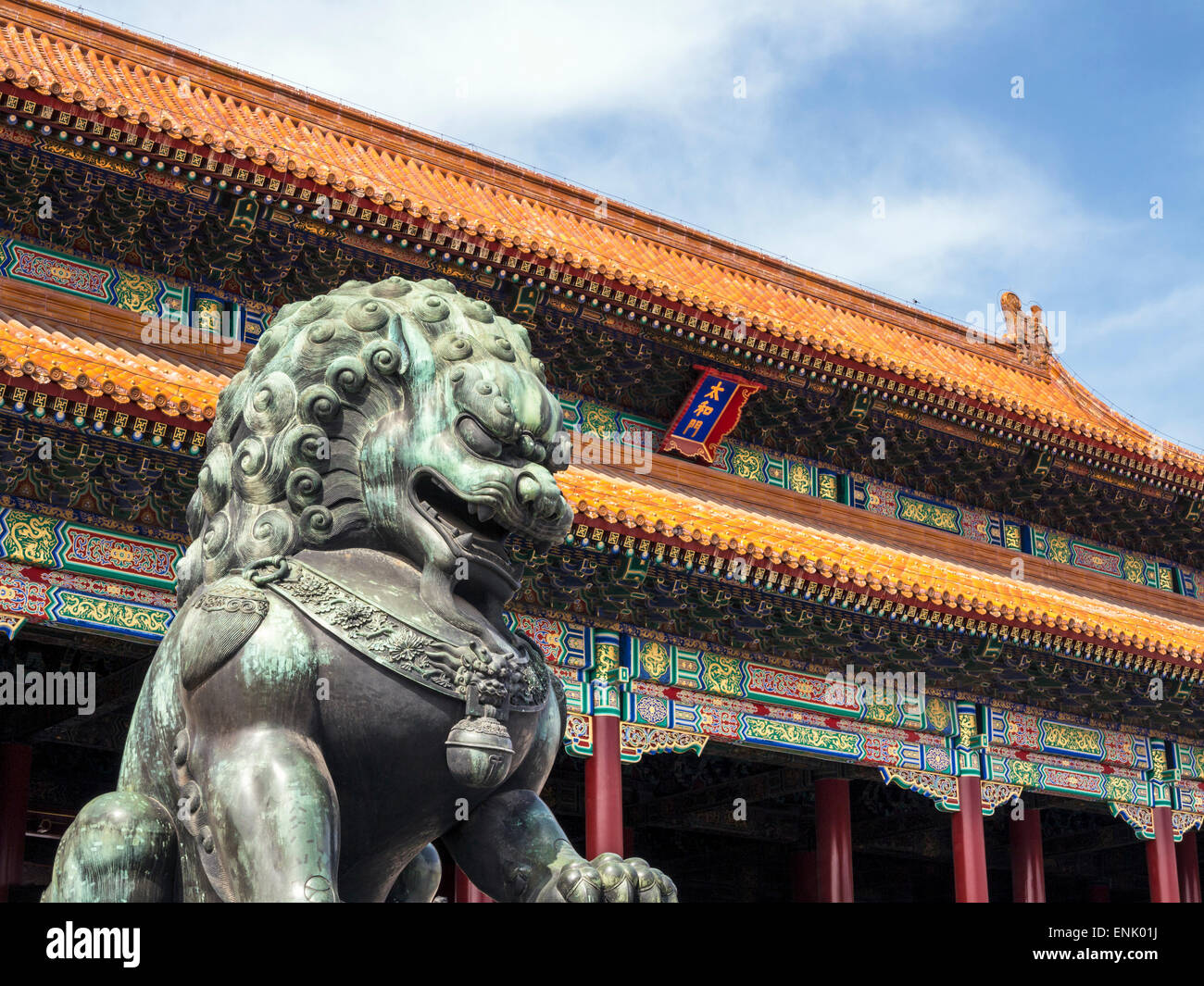 Bronze Chinese lion (female) guards the entry to the palace buildings ...