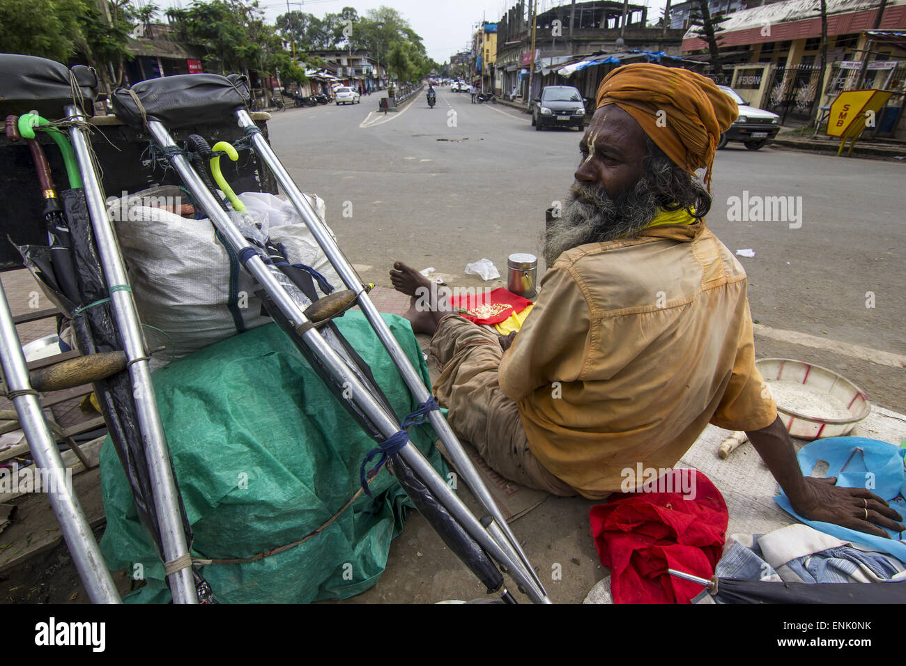 Sivasagar, Assam, India. 7th May, 2015. An Indian homeless handicapped ...