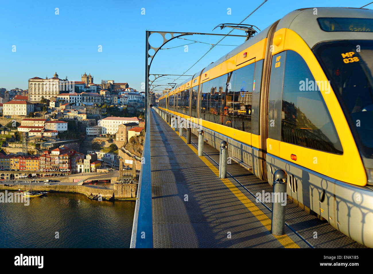 Modern light rail tram over the Dom Luis bridge in Porto city, Portugal ...