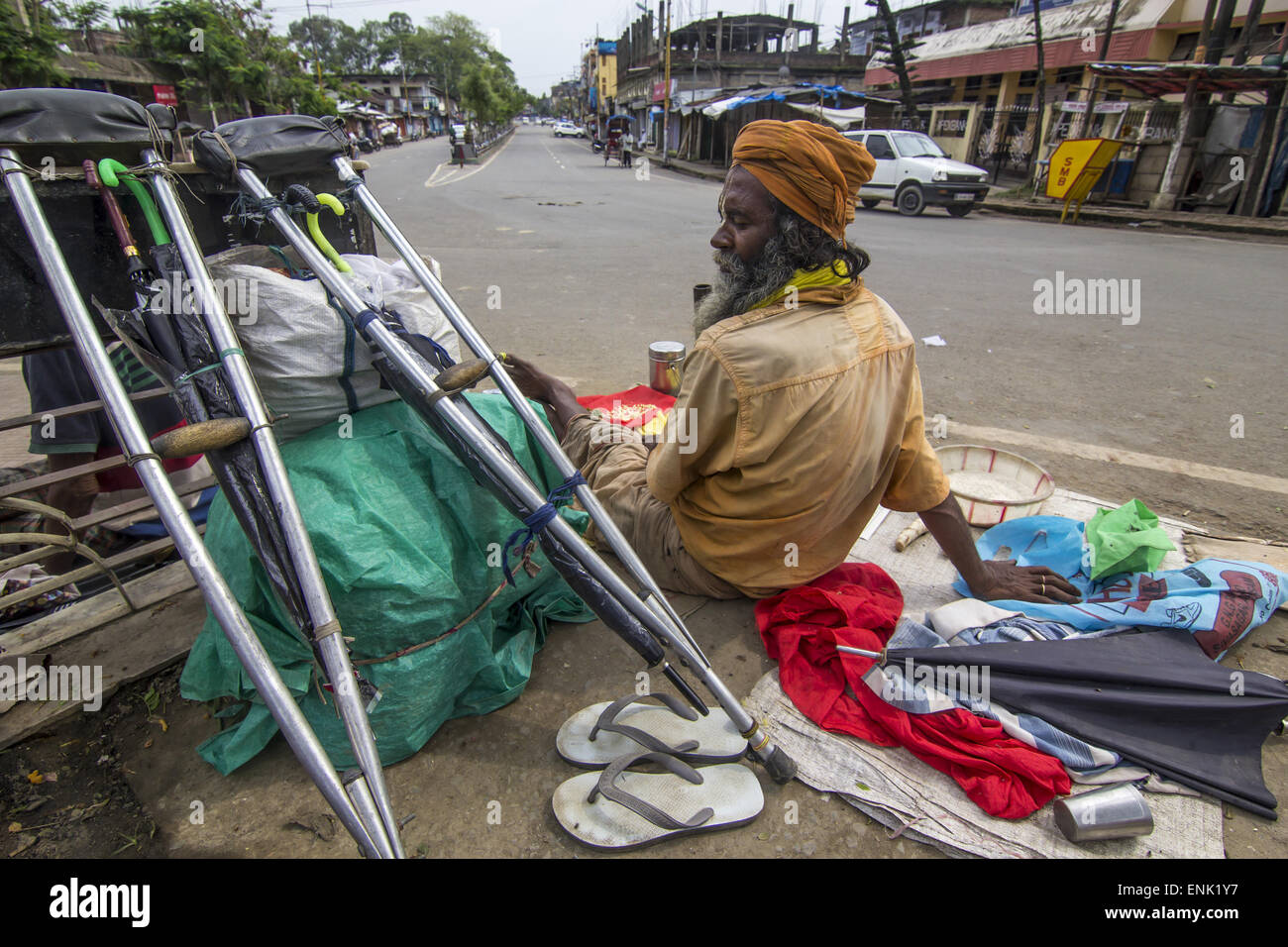 Sivasagar, Assam, India. 7th May, 2015. An Indian homeless handicapped ...