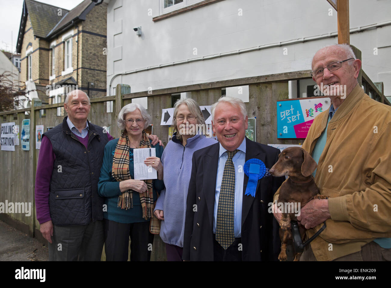 Bob Neill MP poses with voters as they arrive to vote at St Nicholas ...
