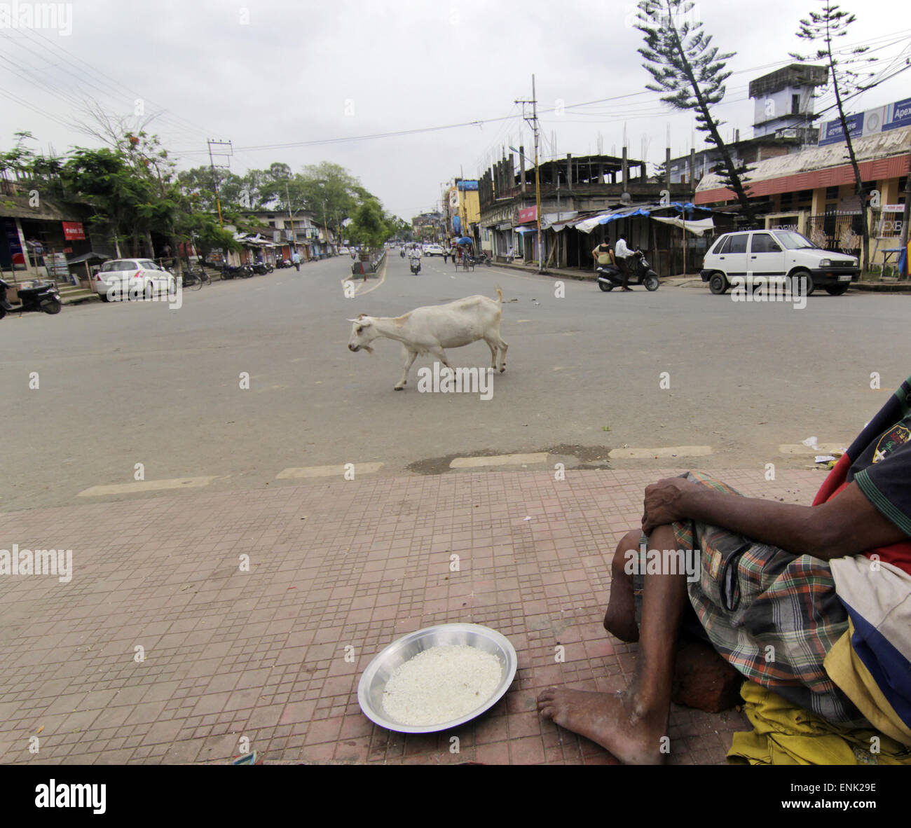 Sivasagar, Assam, India. 7th May, 2015. An Indian homeless handicapped ...
