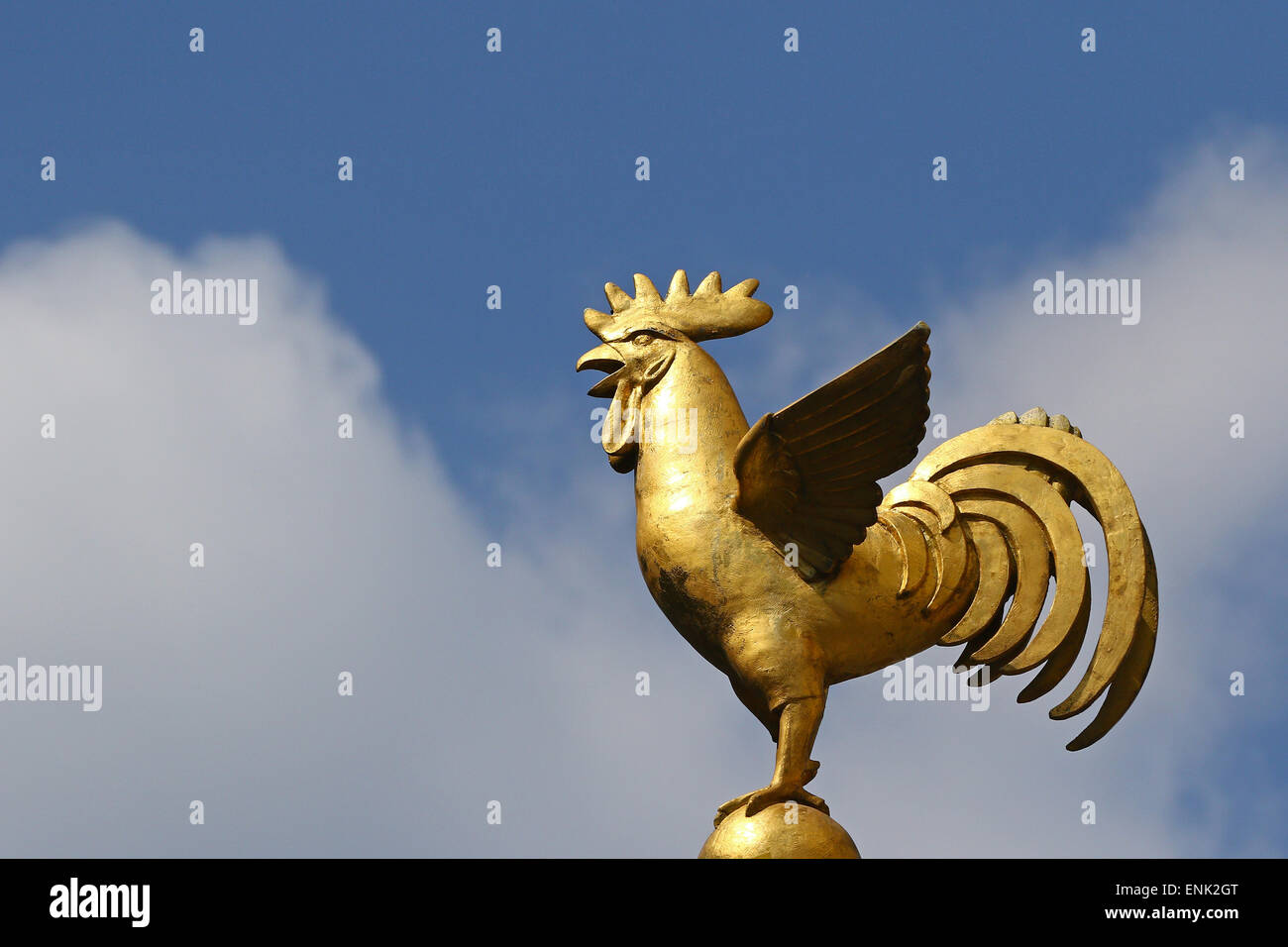 Glod colored cock as a street decoration Stock Photo - Alamy