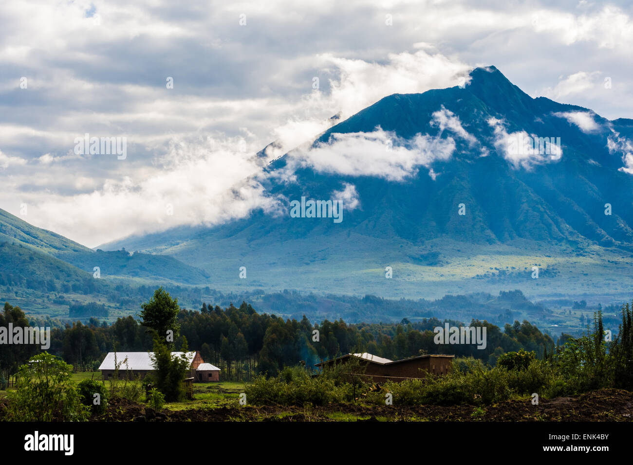 Houses, mountains, and clouds in Parc National des Volcans, Rwanda ...